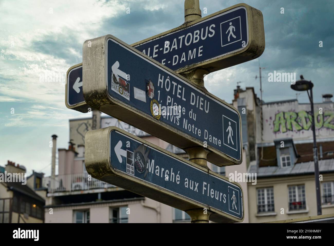 Multiple pedestrian signs pointing to landmarks in Paris, France Stock ...