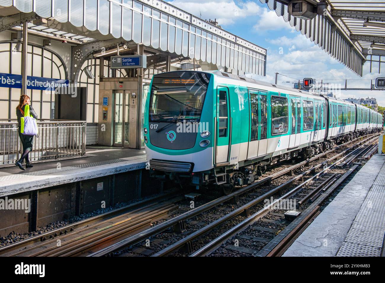 On the platform at the Barbes-Rochechouart Metro Station in Paris ...