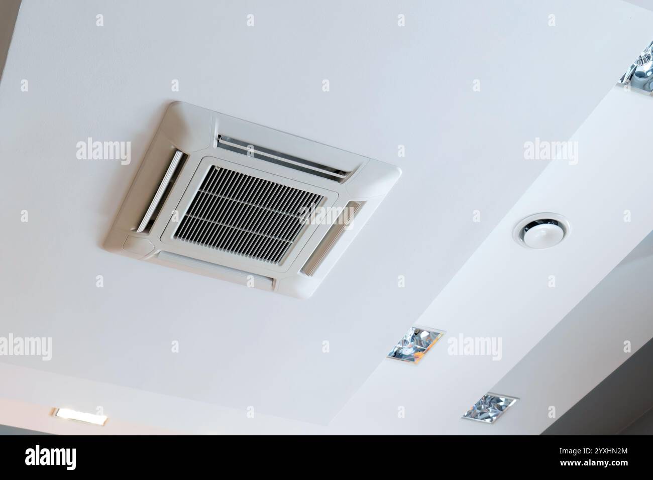 Modern ceiling HVAC air conditioning system in office building, air ...