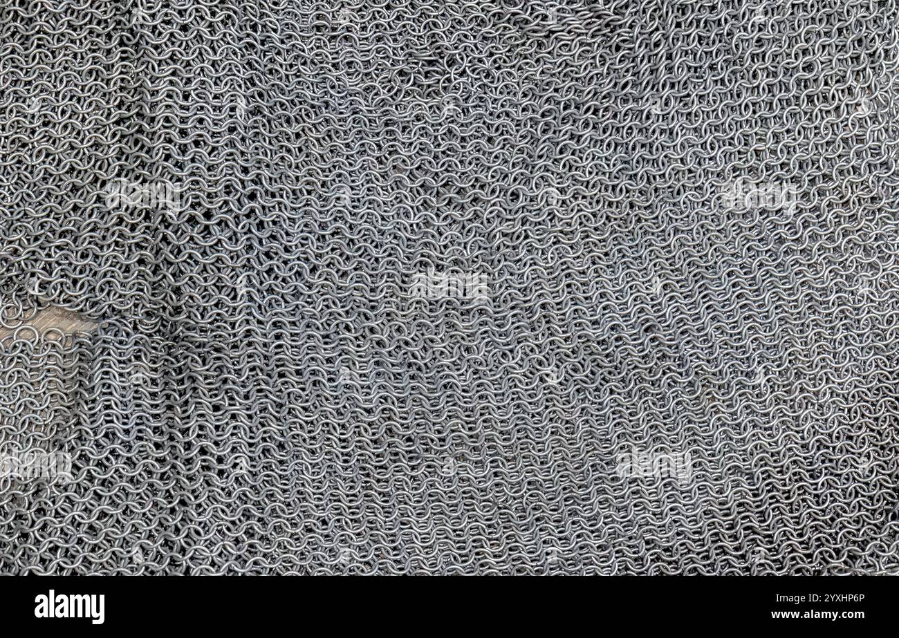 Medieval steel chain armor structure detail, metal chainmail texture background, close-up of ...