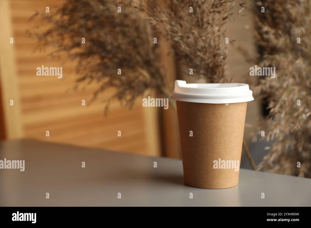 Paper cup on grey table indoors, closeup. Mockup for design Stock Photo ...