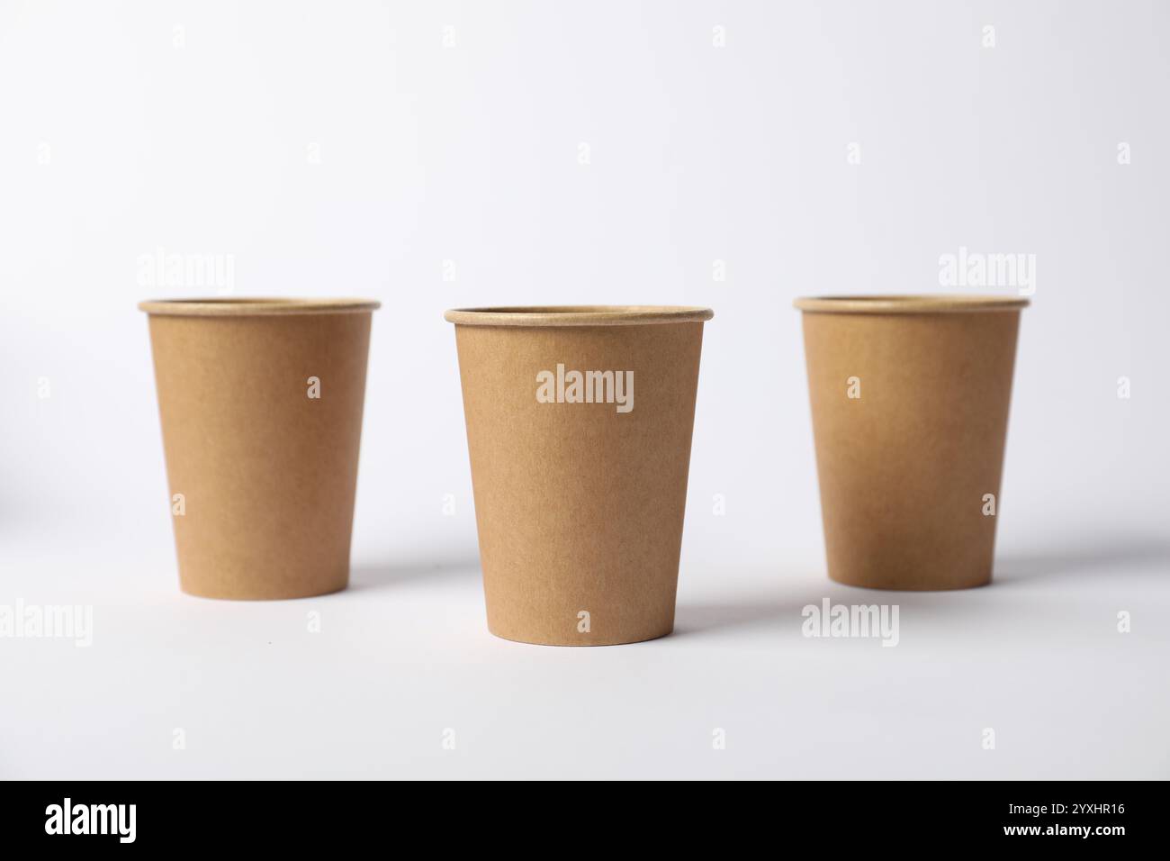 Paper cups on white background. Mockup for design Stock Photo - Alamy