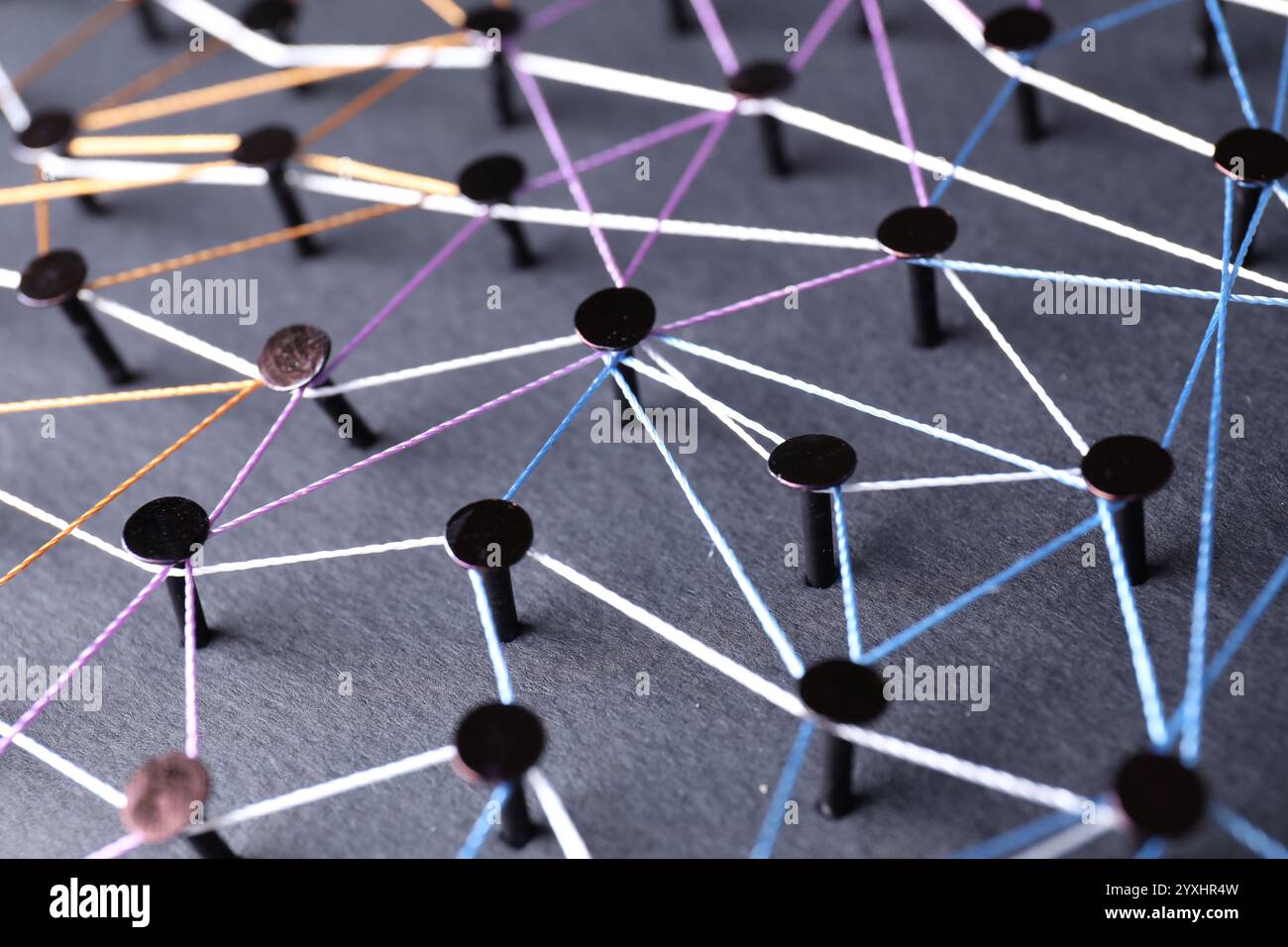 Network connection. Nails linked together by threads on black ...