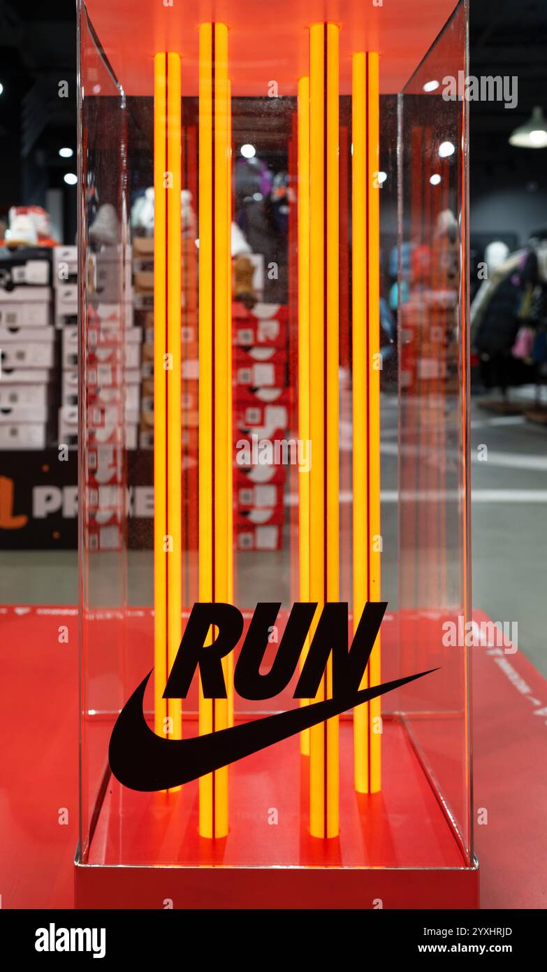 NIKE logo. Neon Nike logo in the interior of the Nike brand store. Nike ...