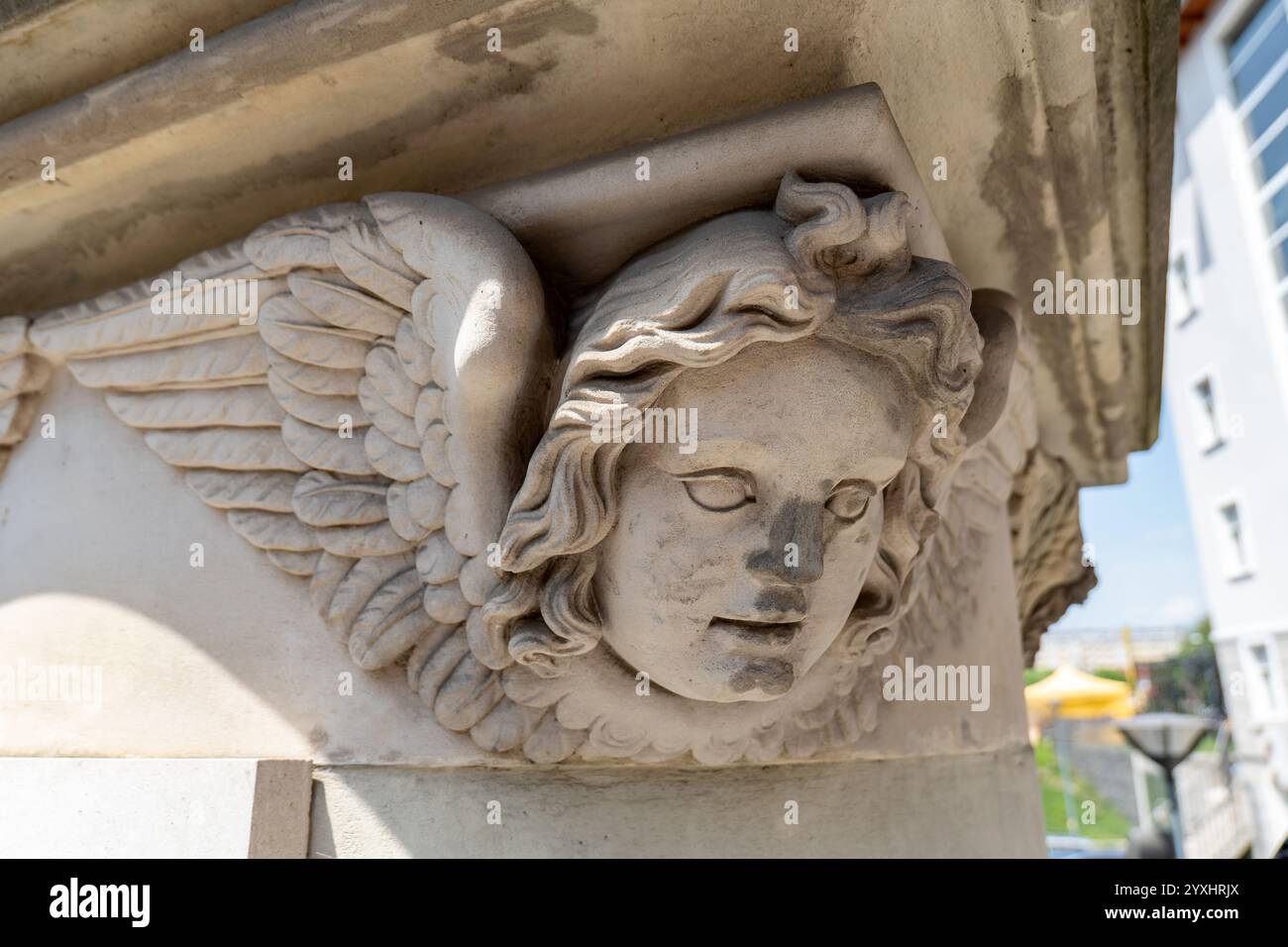Stone angel head sculpture closeup on monument with intricate wing ...