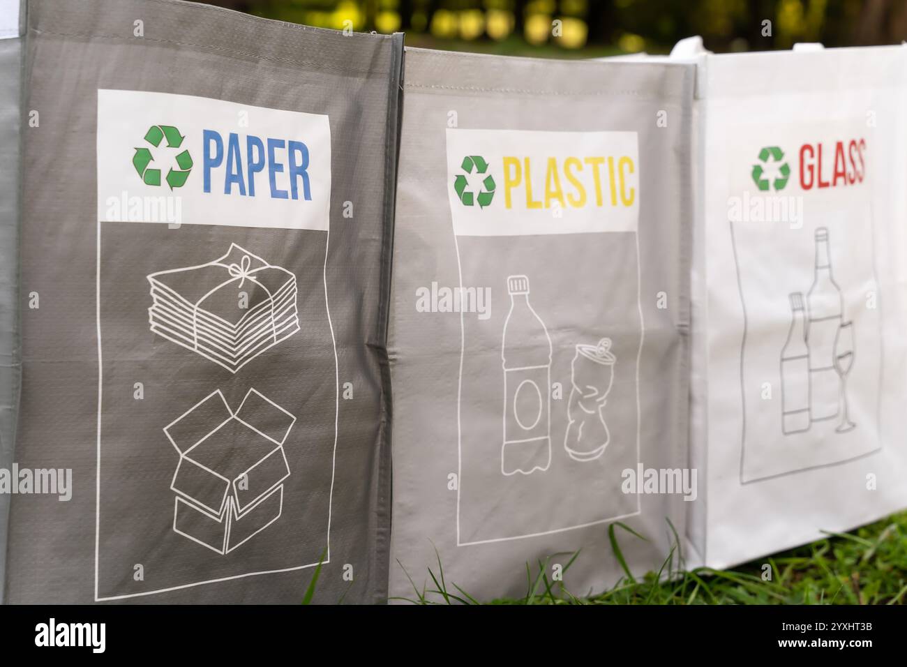 Separating waste into bags for recycling and reusing plastic glass and ...