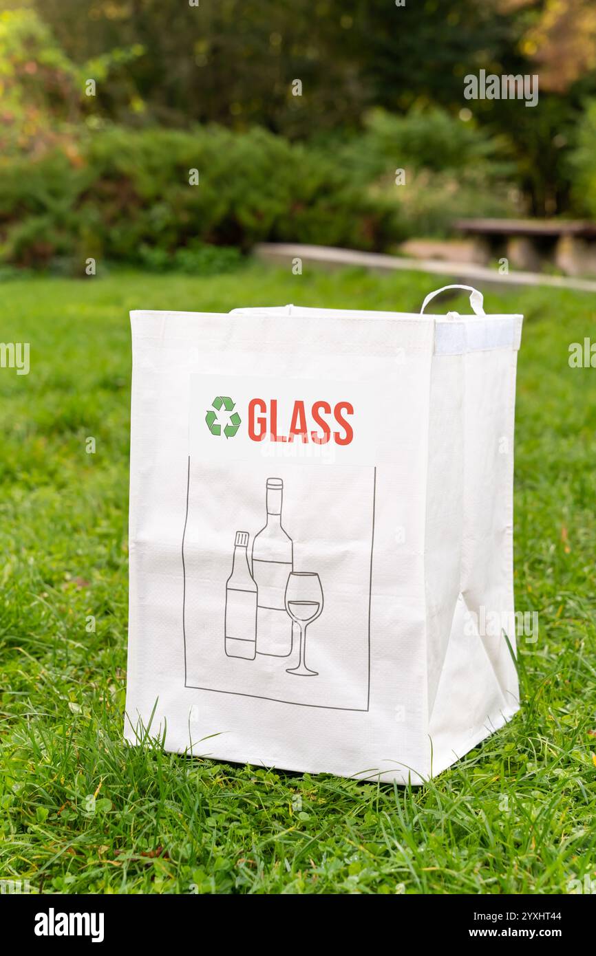Bag for sorting glass garbage in park Stock Photo - Alamy