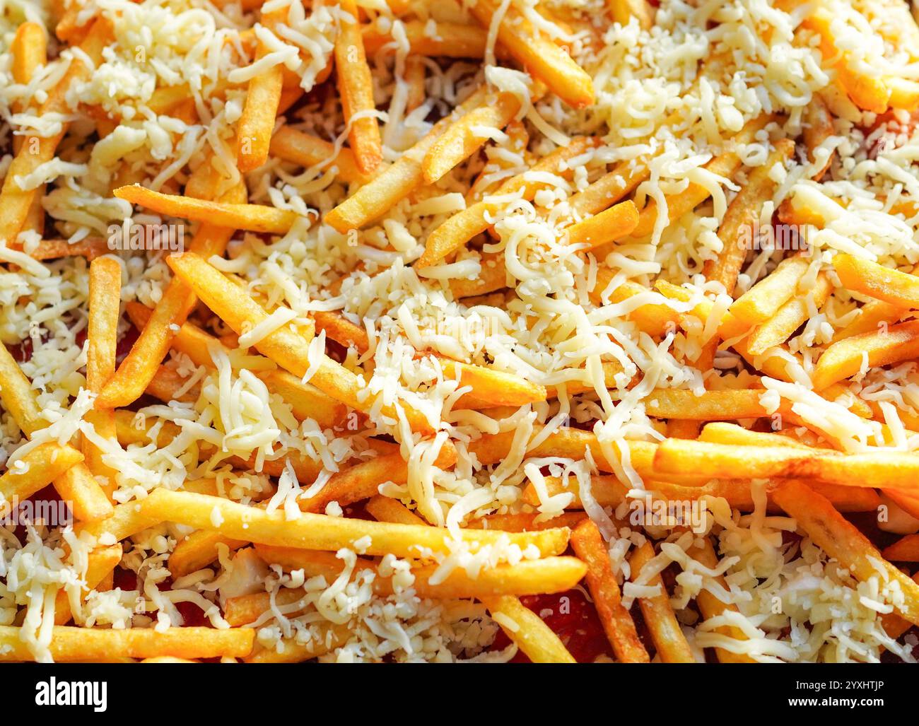 Crispy French fries topped with lots of fresh cheese, top view Stock ...
