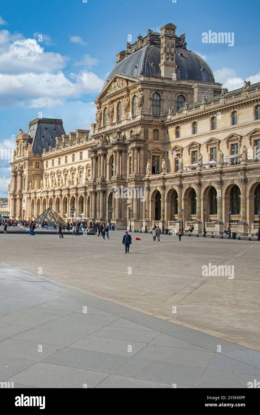 People at the Musee du Louvre with the famous glass Pyramid. One of ...