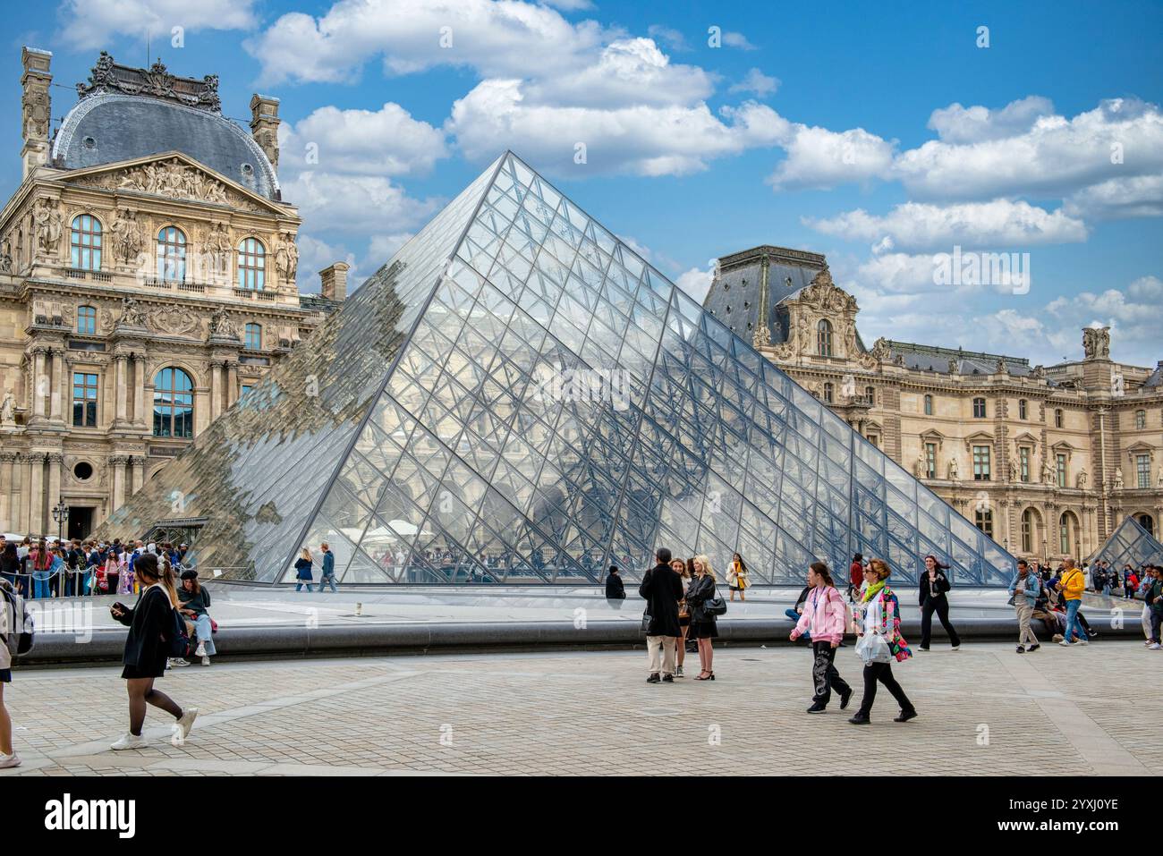 People at the Musee du Louvre with the famous glass Pyramid. One of ...
