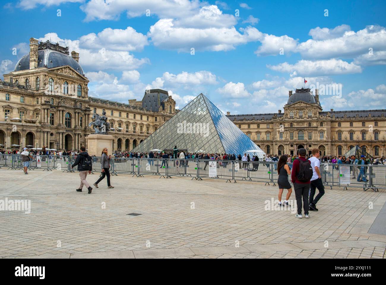People at the Musee du Louvre with the famous glass Pyramid. One of ...