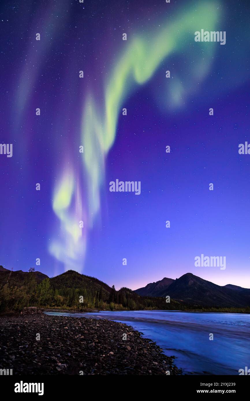 The Aurora Borealis looks like a column of smoke as it dances over the ...