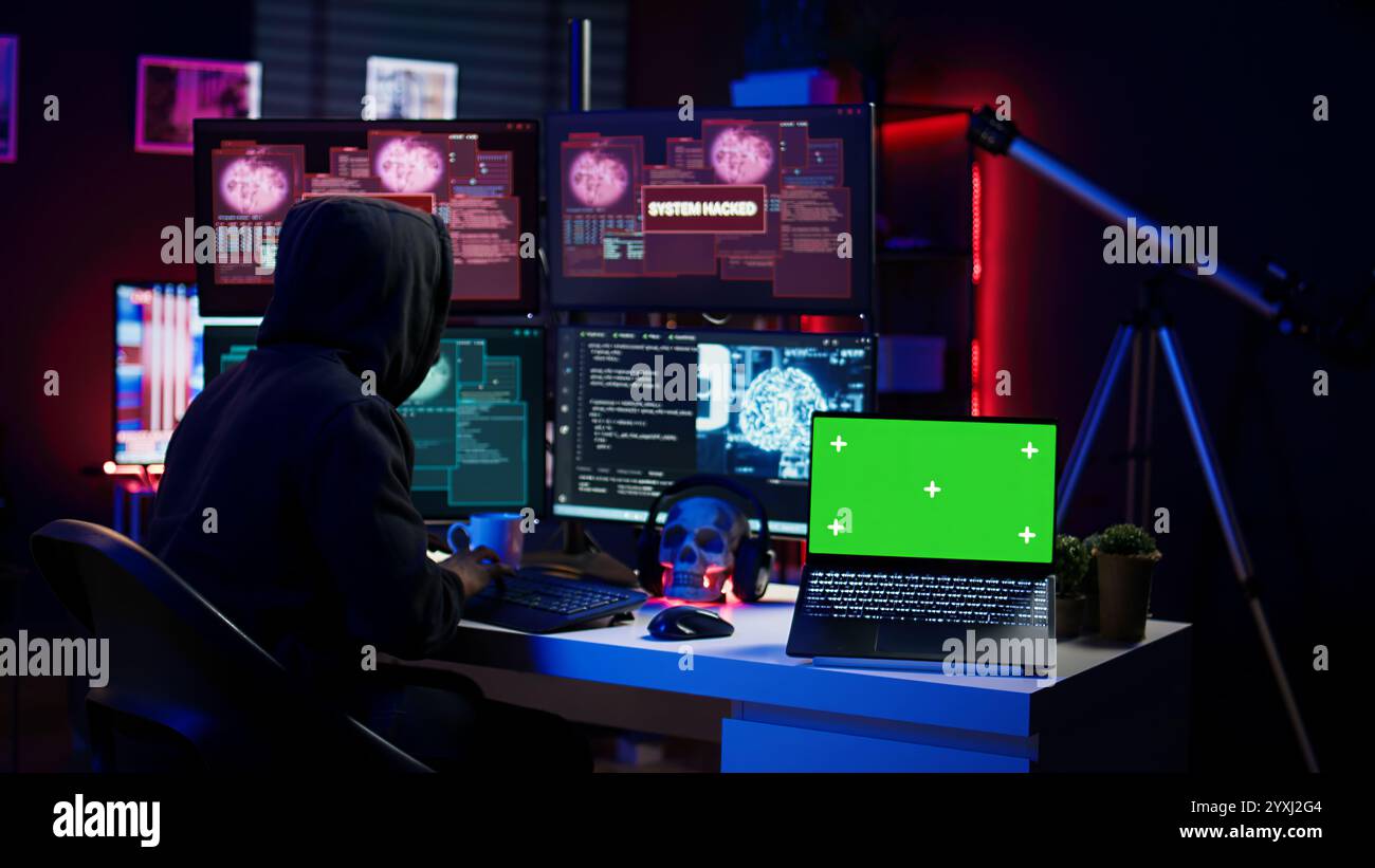 Green Screen Laptop Used By Hacker In Underground Hideout To Write Lines Of Code Developing