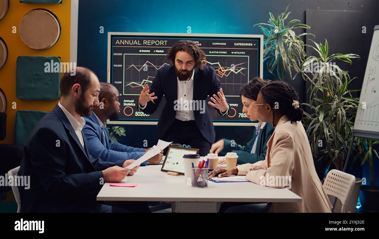 Startup team analyzing success metrics and key performance indicators ...