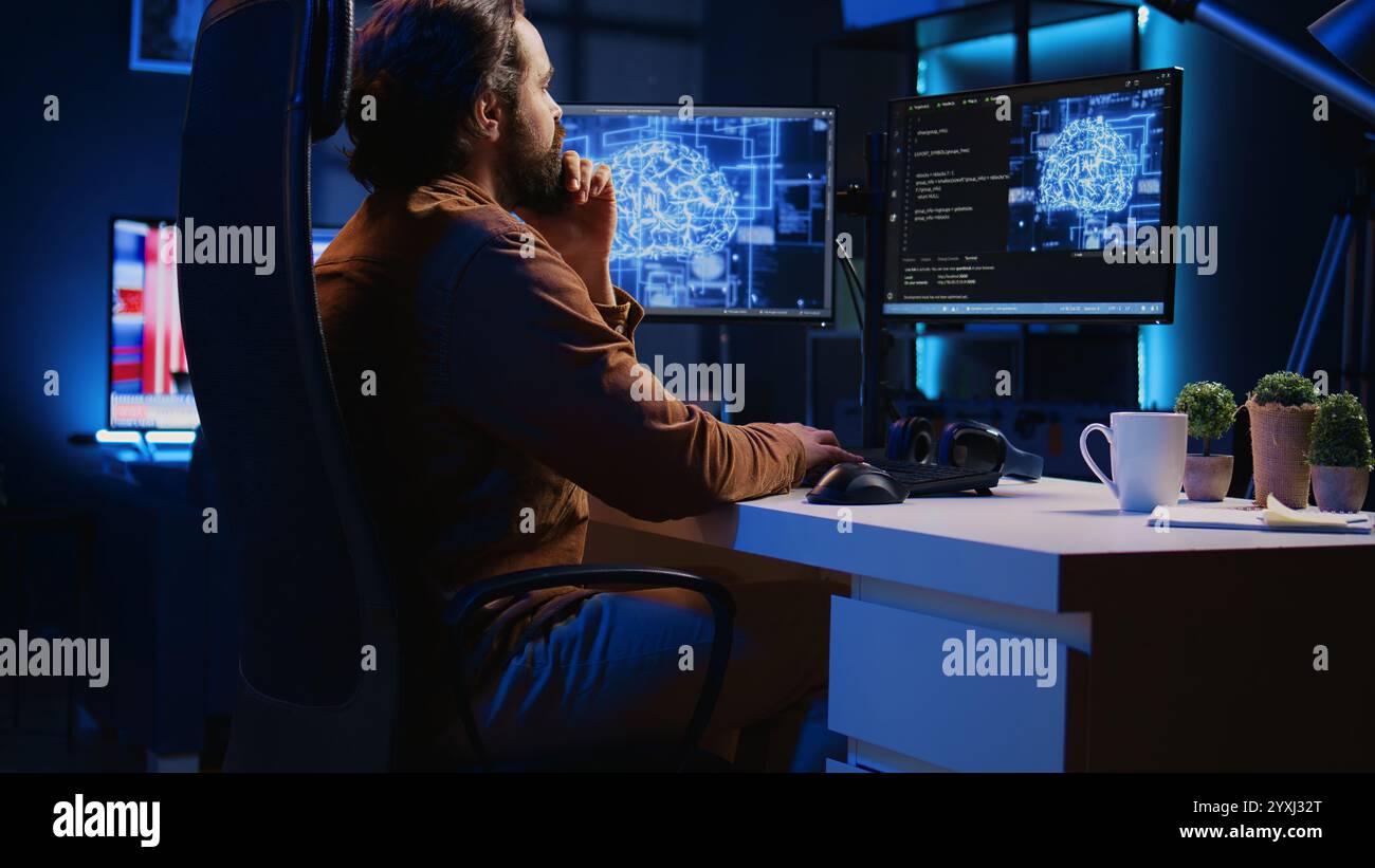 Freelancing programmer writes code on desktop PC to visualize ...