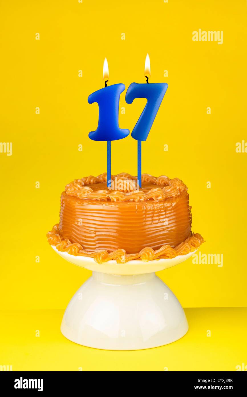 Happy birthday cake with number 17 candle - Card on a yellow background ...