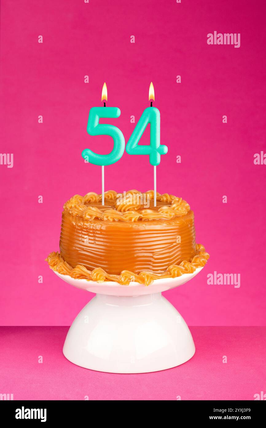 Birthday cake with number 54 candle - Anniversary card on a pink ...