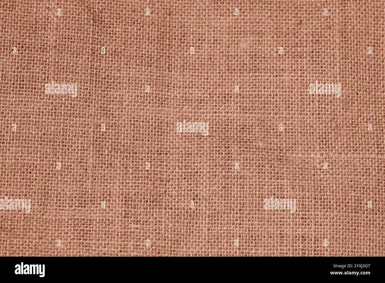 Burlap fabric texture with detailed woven fibers in natural brown tones. Rustic material and eco ...