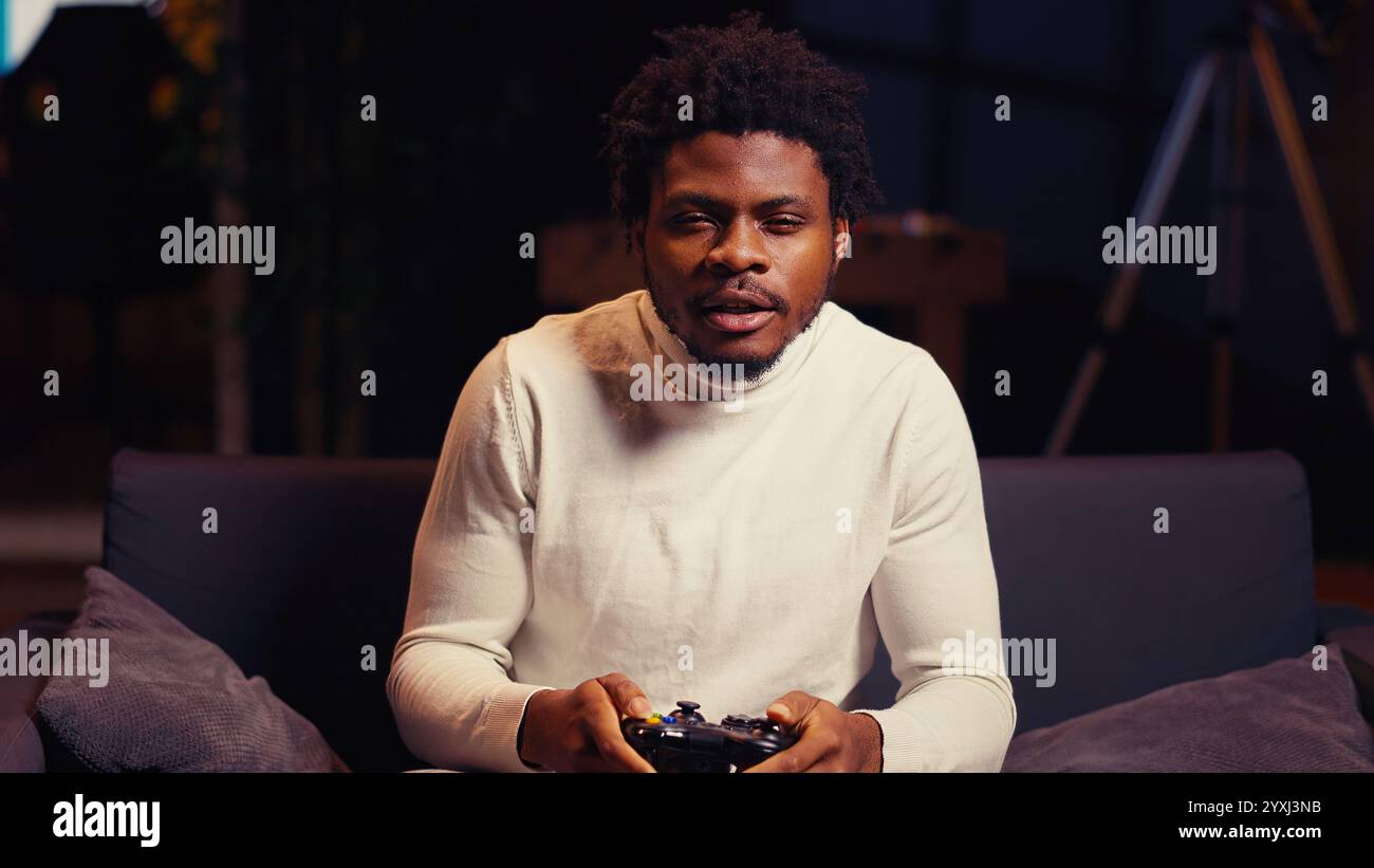 Cheerful gamer feeling excited after finally defeating all enemies and ...