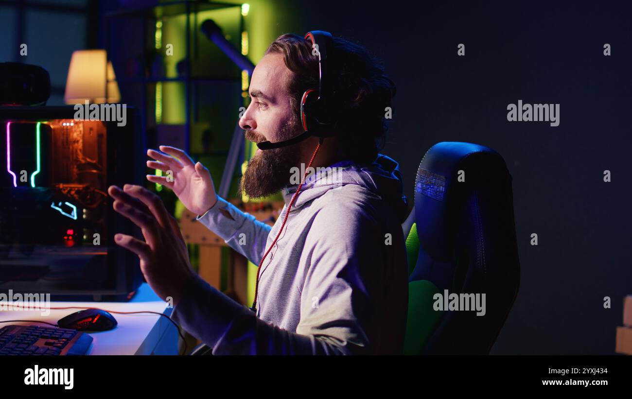 Surprised gamer playing videogame neon hi-res stock photography and ...