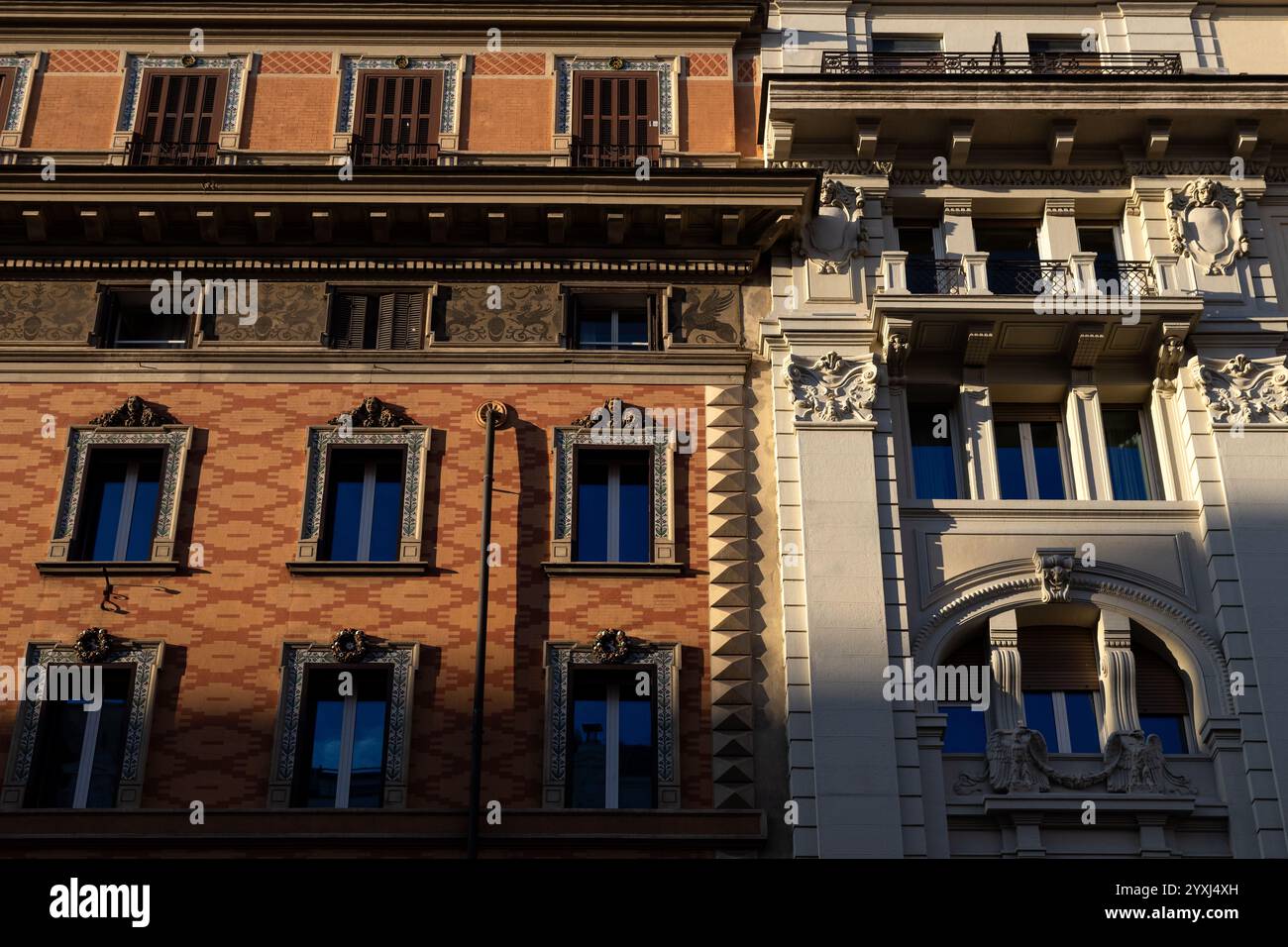 Light and shadow reveal the intricate facades of historic buildings on ...