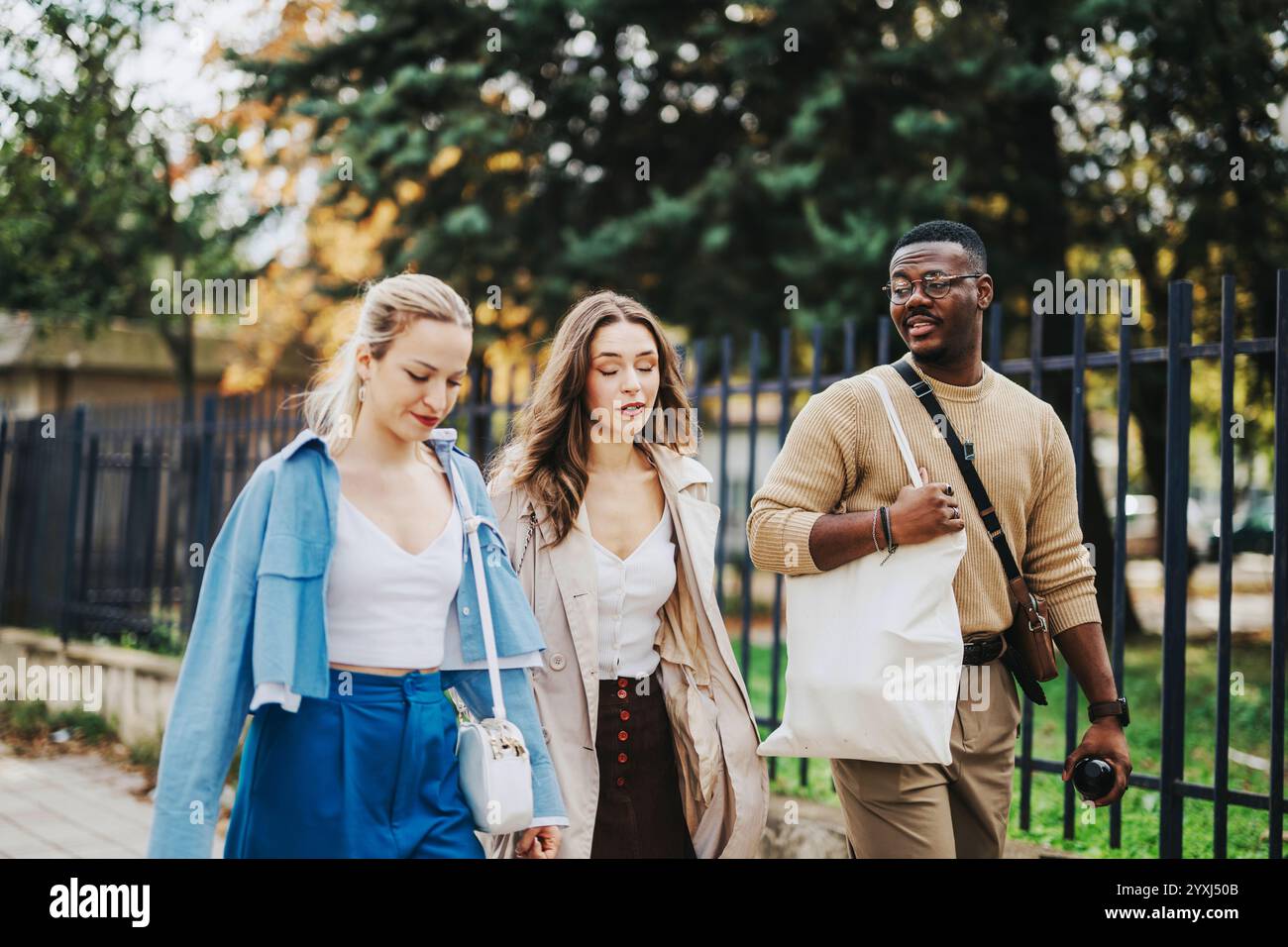 Group friends strolling through serene hi-res stock photography and ...