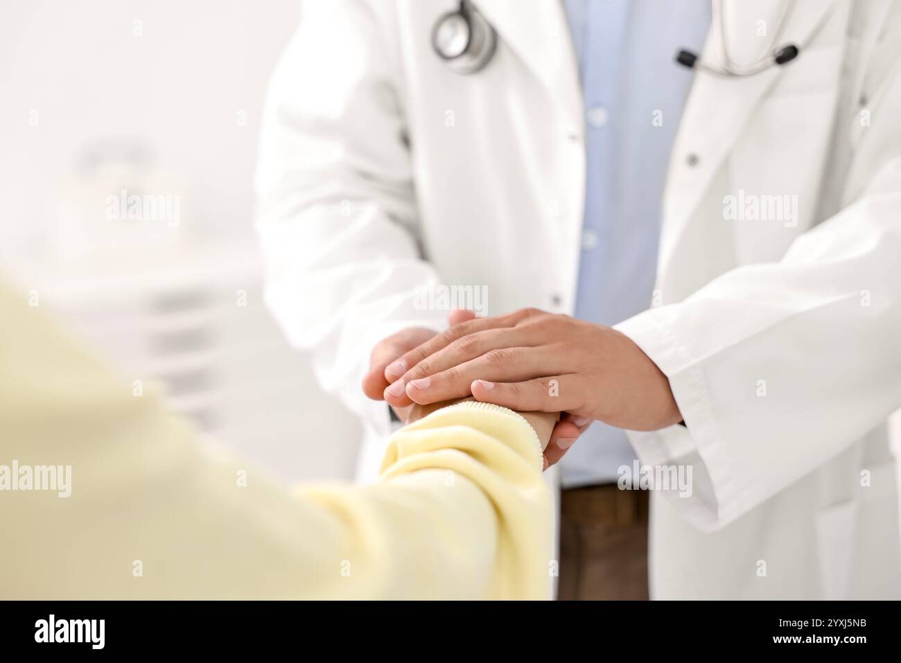 Healthcare worker supporting patient in hospital, closeup Stock Photo ...