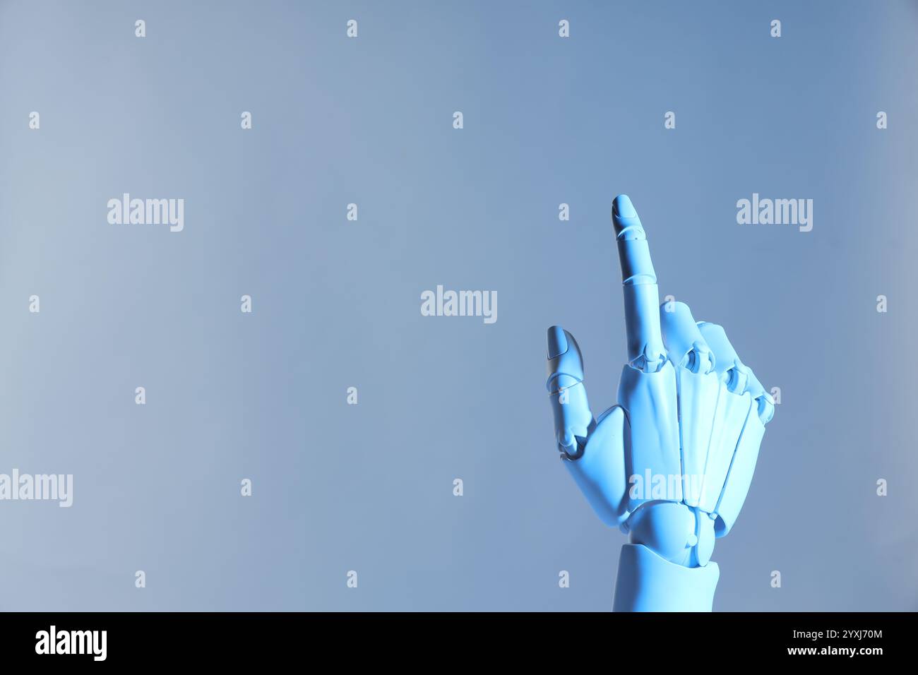 Artificial intelligence. Robot hand pointing at something on pale light ...