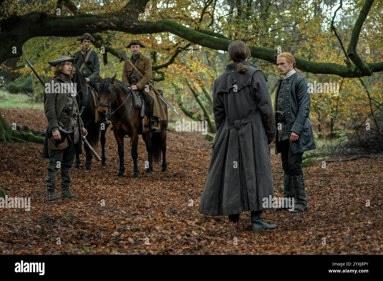 OUTLANDER, foreground from left: David Berry, Ben Freeman, Sam Heughan ...