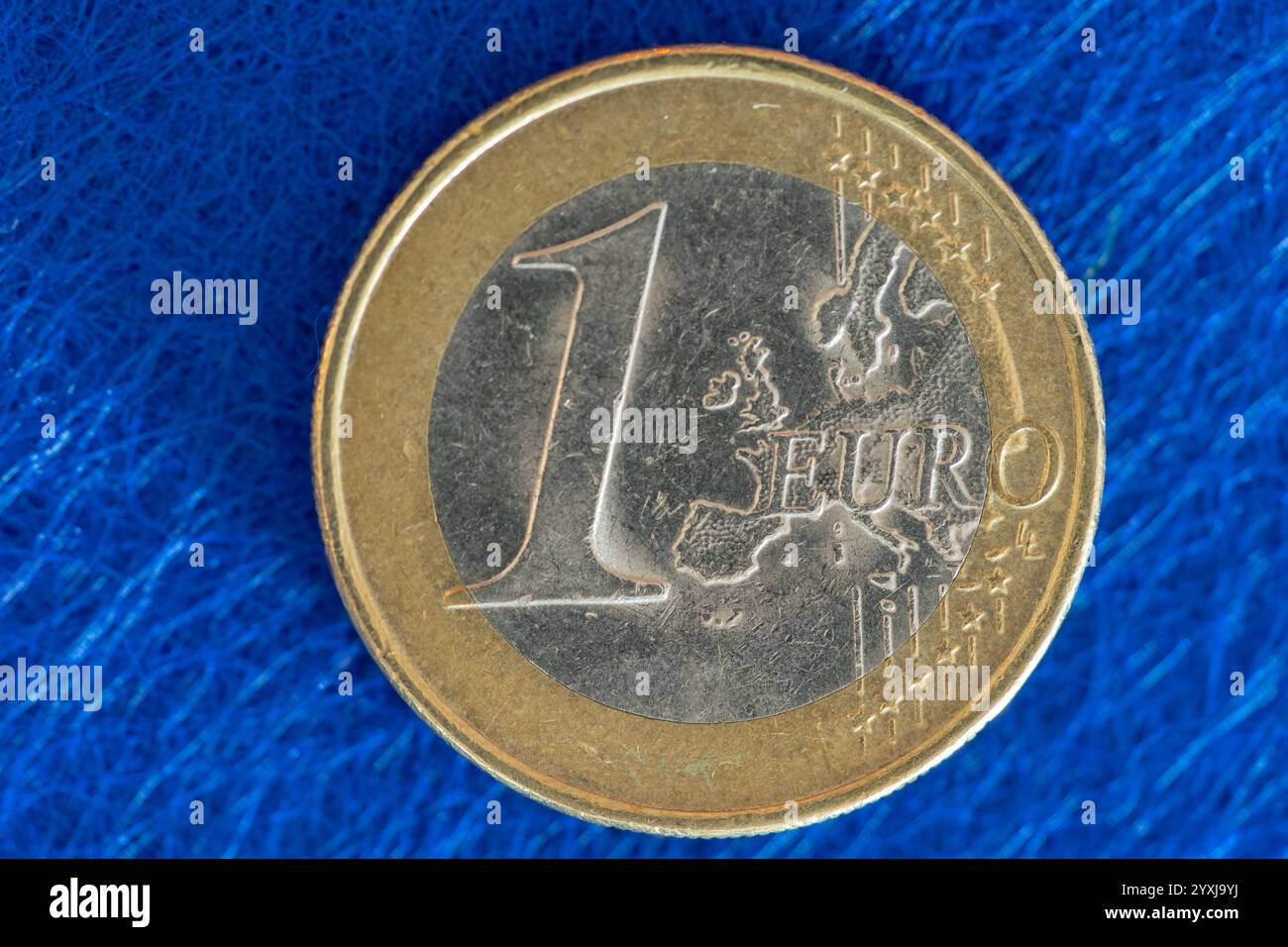 1 euro coin face up under a blue surface Stock Photo - Alamy