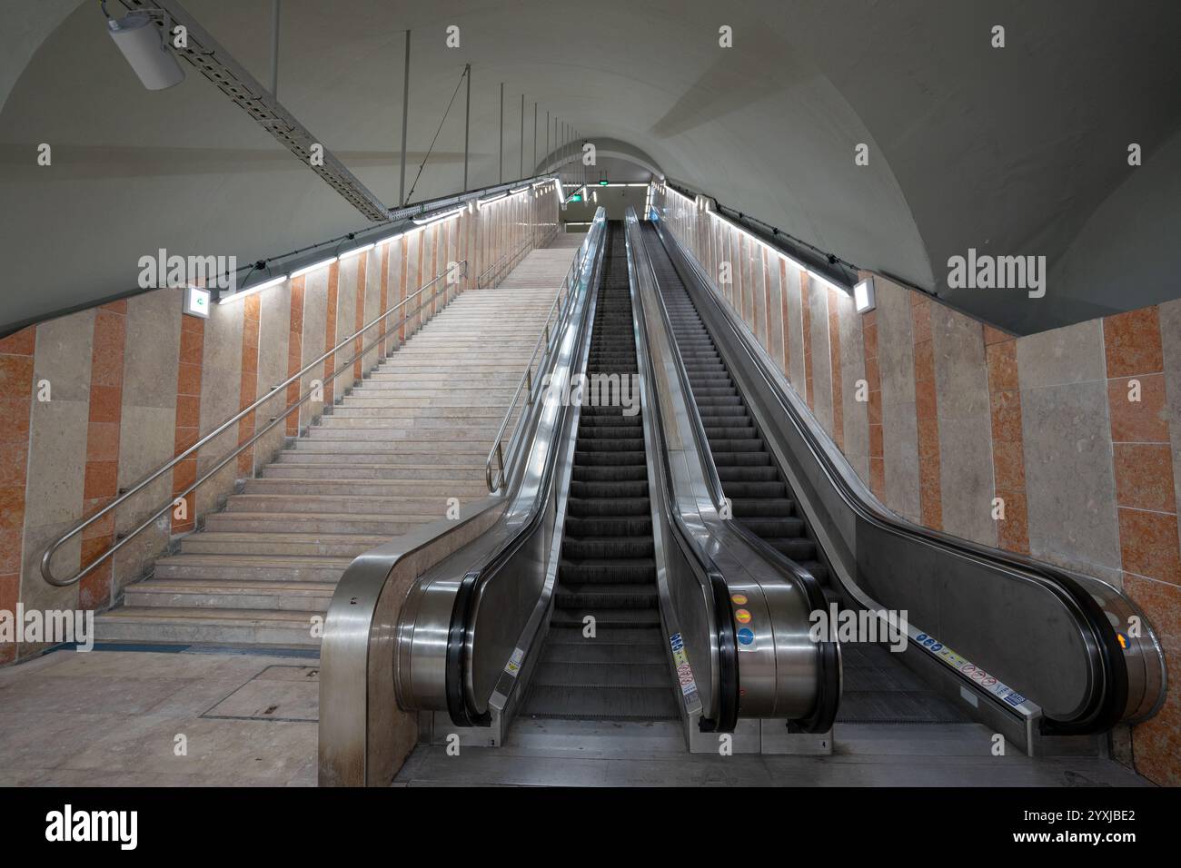 Escalators in the underground interior of the cabo ruivo metro station ...
