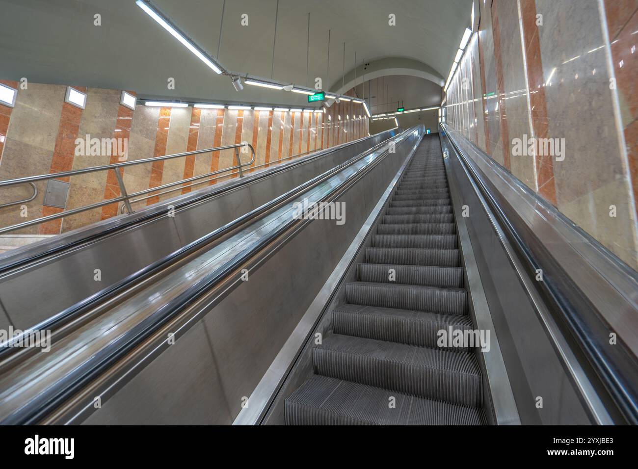 Escalators in the underground interior of the cabo ruivo metro station ...