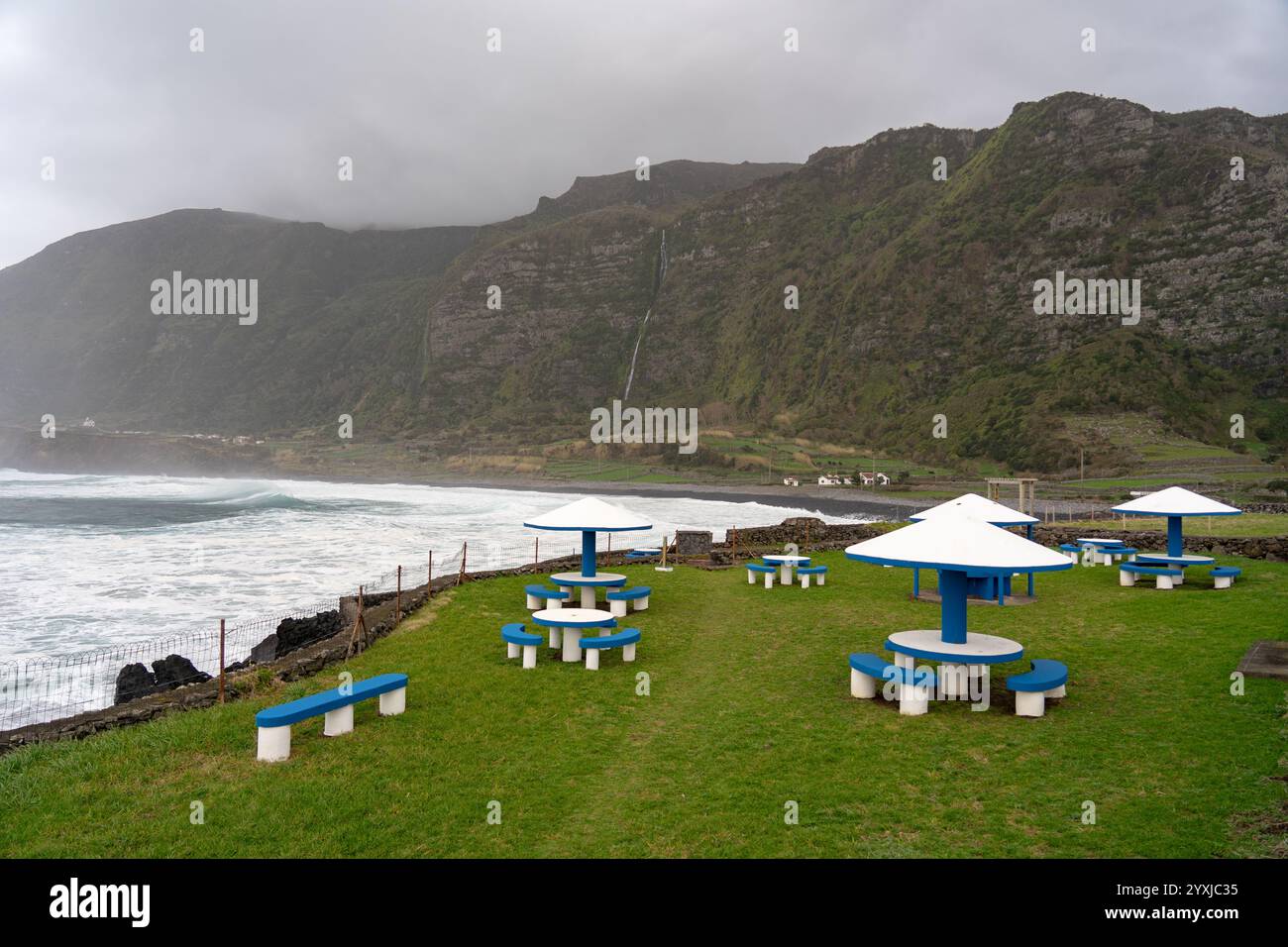 Stone table and benches in the picnic area on the island of flowers of ...