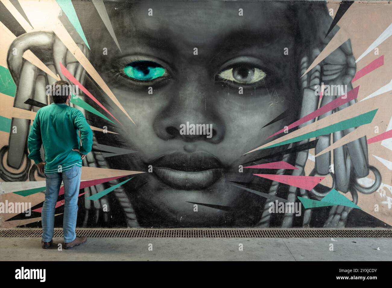 White man with unidentifiable back dressed in a gray sweater looking at ...