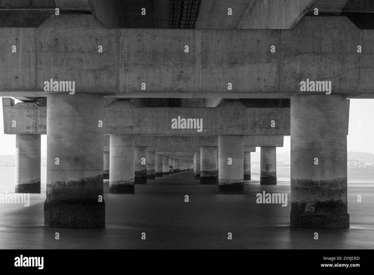 Part under the Vasco da Gama bridge in perspective of infinity with the ...