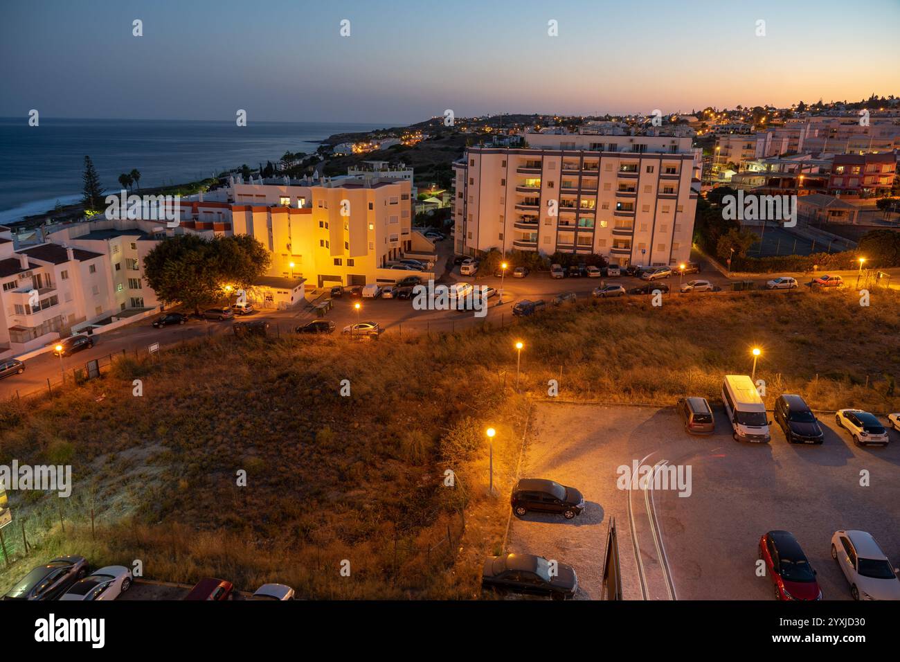 Night image with the crescent moon and lightning in the village of luz ...