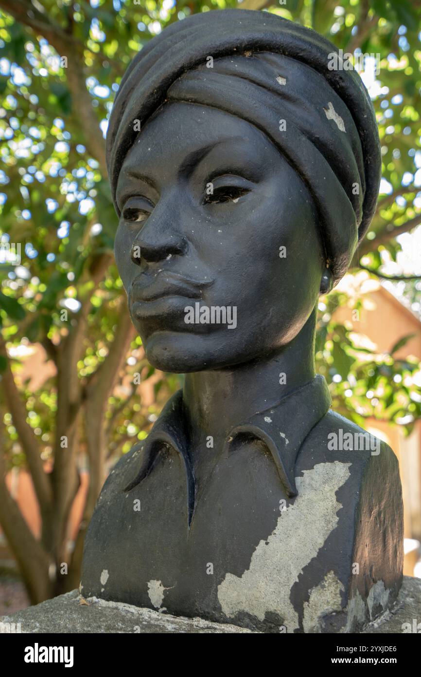 Dark stone bust of African black woman. Lisbon botanical garden.Lisbon ...