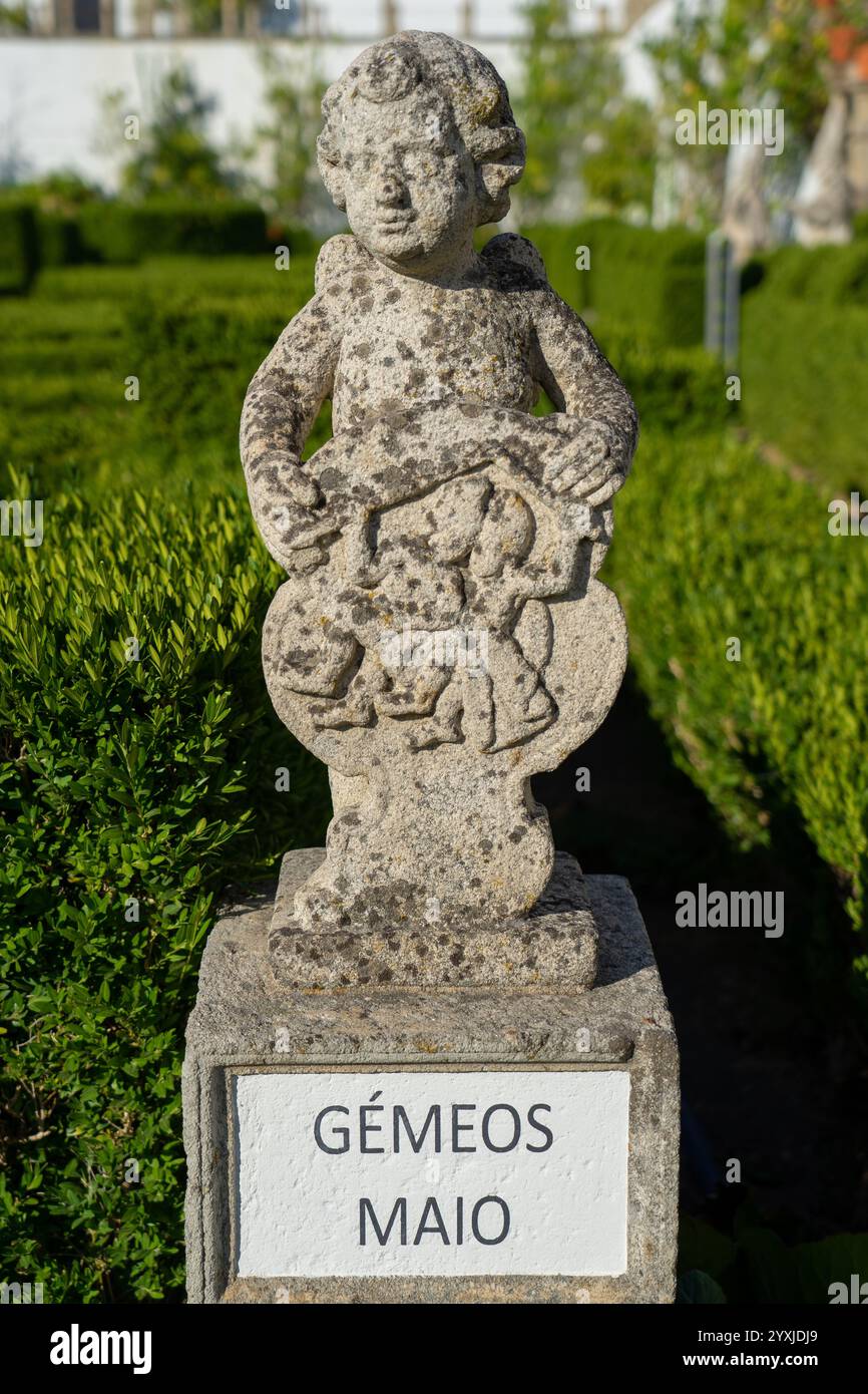 Stone statue depicting the twins sign belonging to the episcopal garden ...