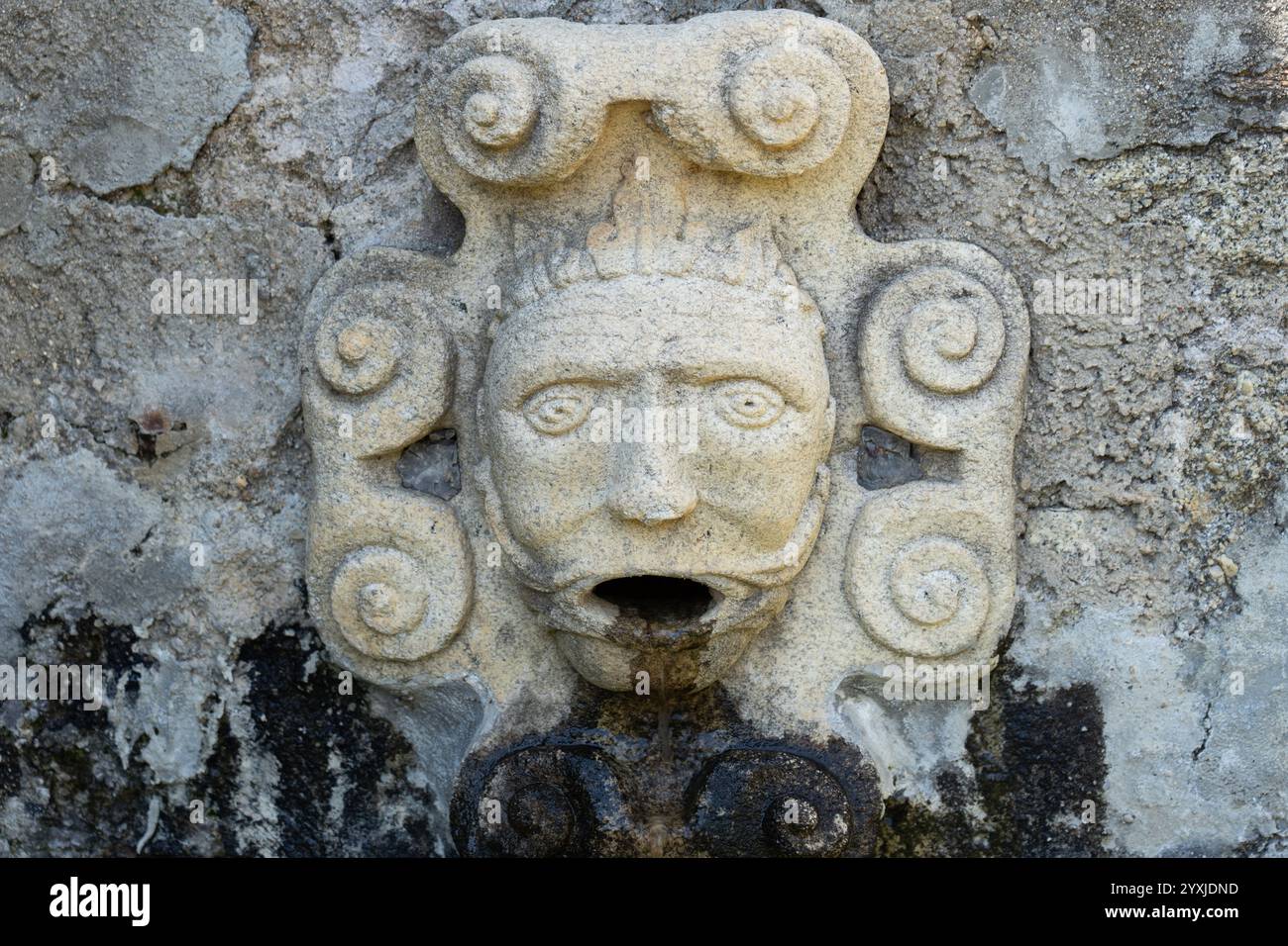 Water source with a human figure head expelling water looking like he ...