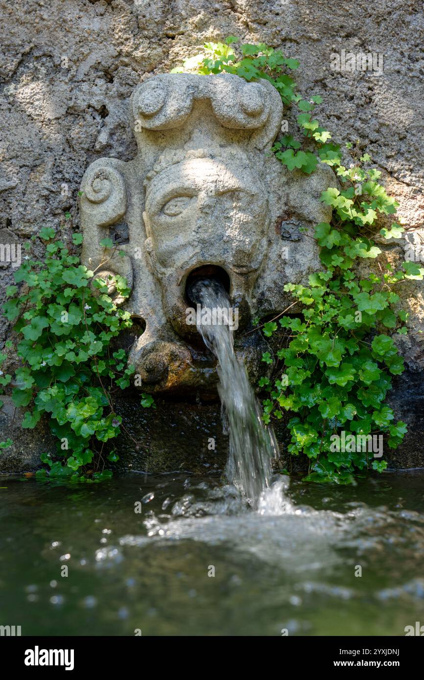 Water source with a human figure head expelling water looking like he ...