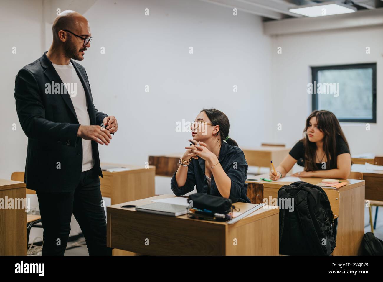 Schoolwork help in class hi-res stock photography and images - Alamy