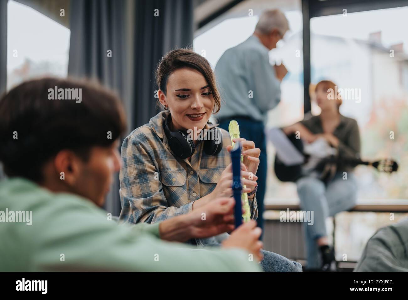 College students enjoying interactive music class experience Stock ...