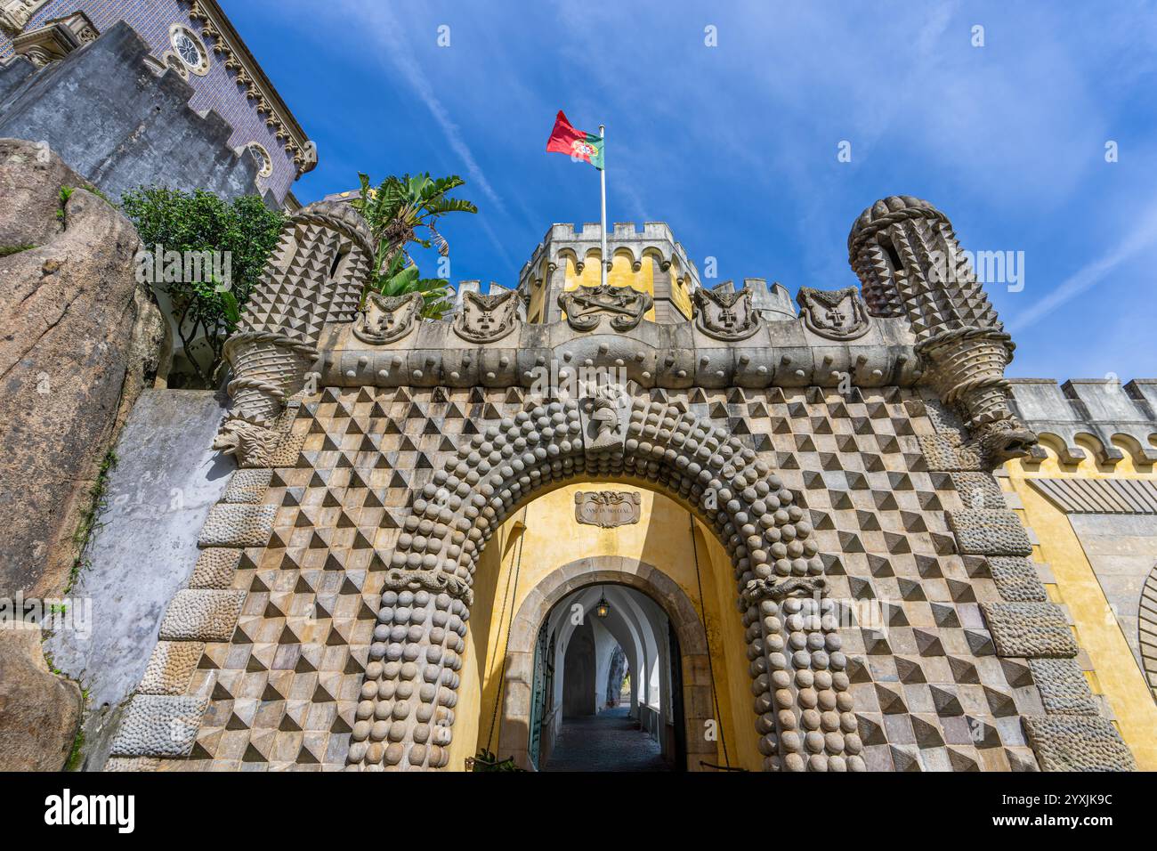 The ornate entrance arch of the Pena Palace features intricate ...