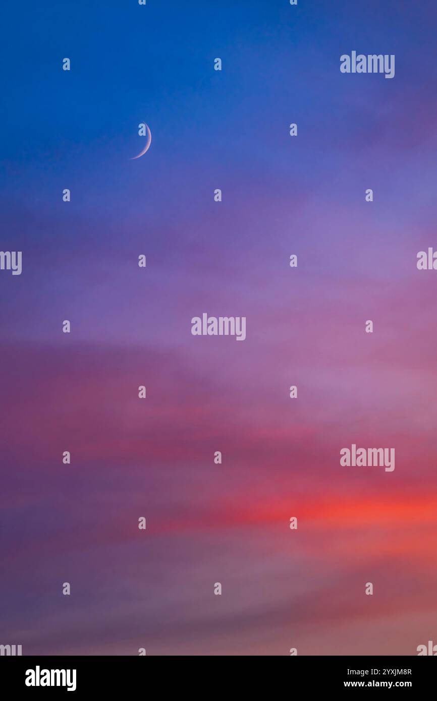 The waxing 3-day-old crescent Moon above Venus amidst a summer sunset ...