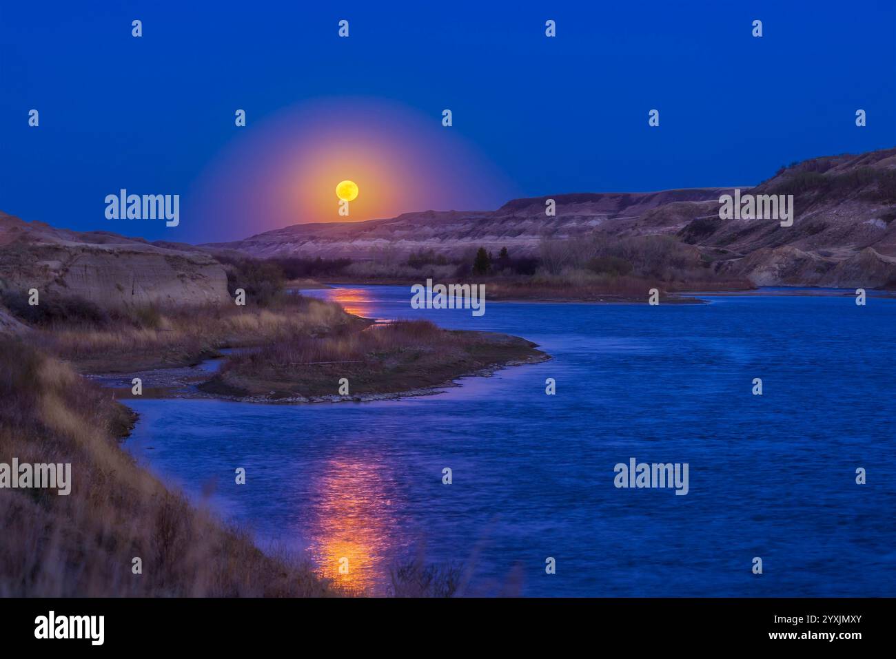 The rising Full Moon coming up over the Red Deer River near East Coulee ...