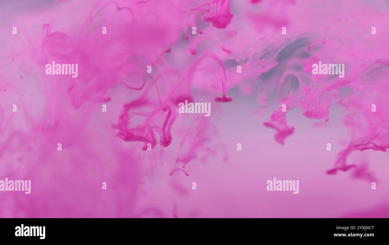 Paint splash. Color flow. Defocused bright pink drops sparkling liquid fluid ink smoking texture ...