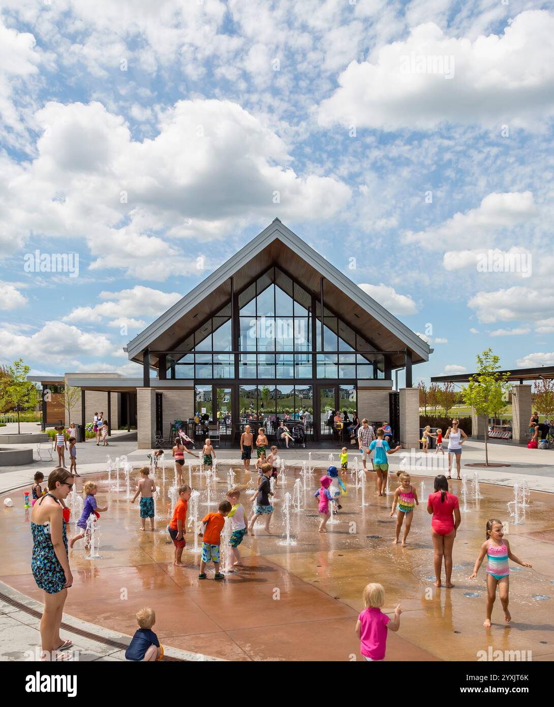 Children and parents enjoying interactive water fountains with new ...