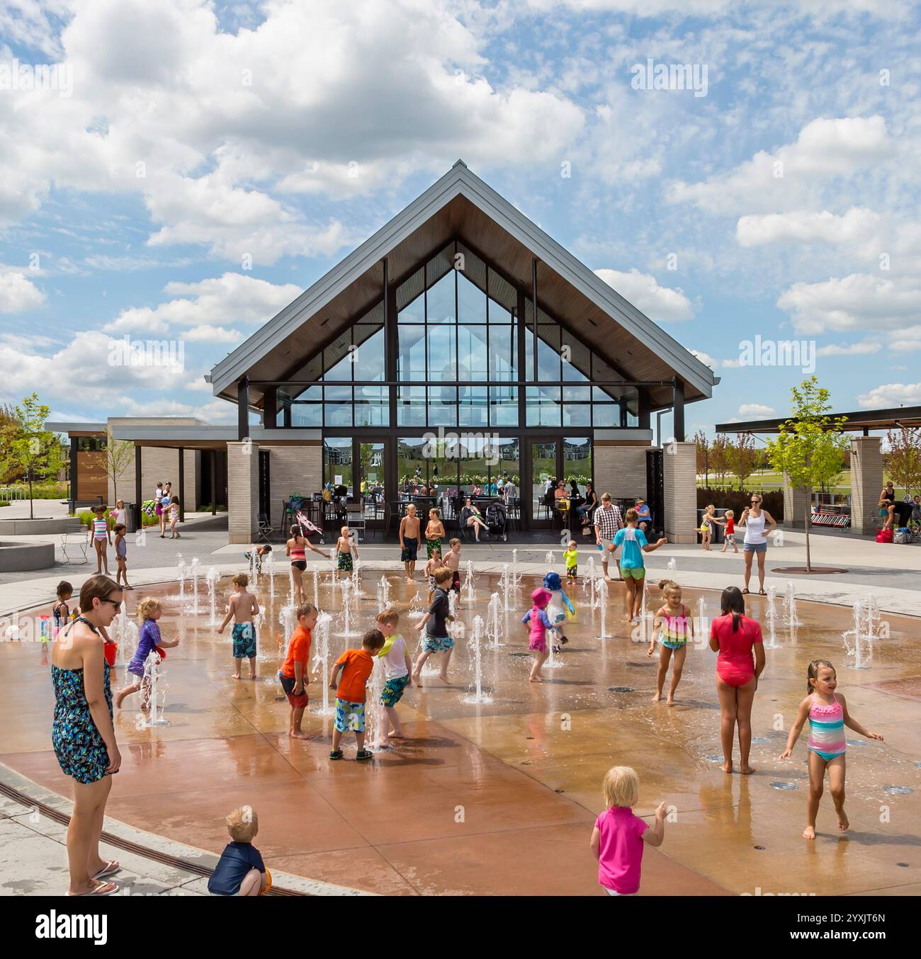 Children and parents enjoying interactive water fountains with new ...