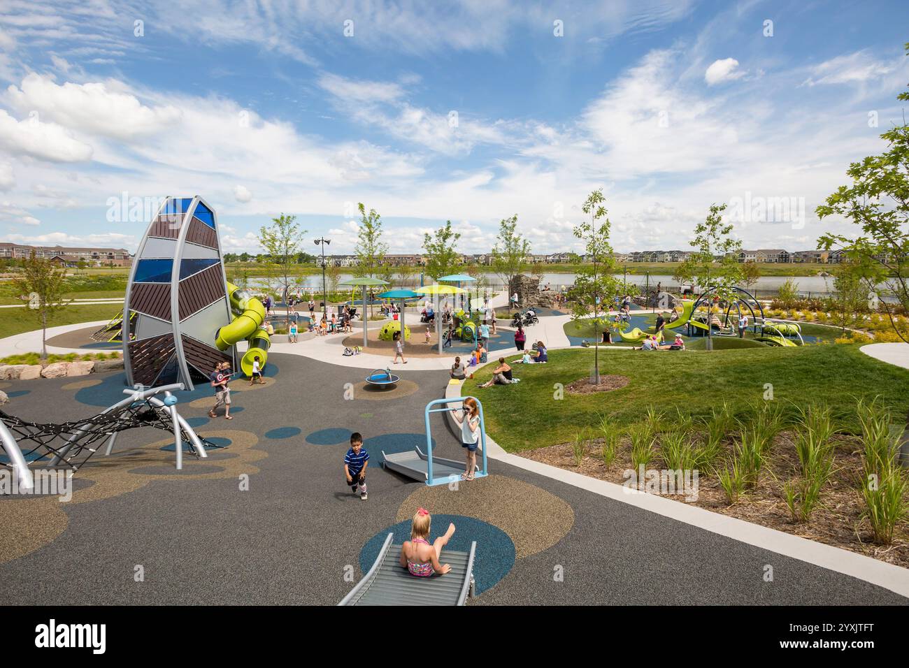 Large playground at new suburban city park with view toward lake Stock ...