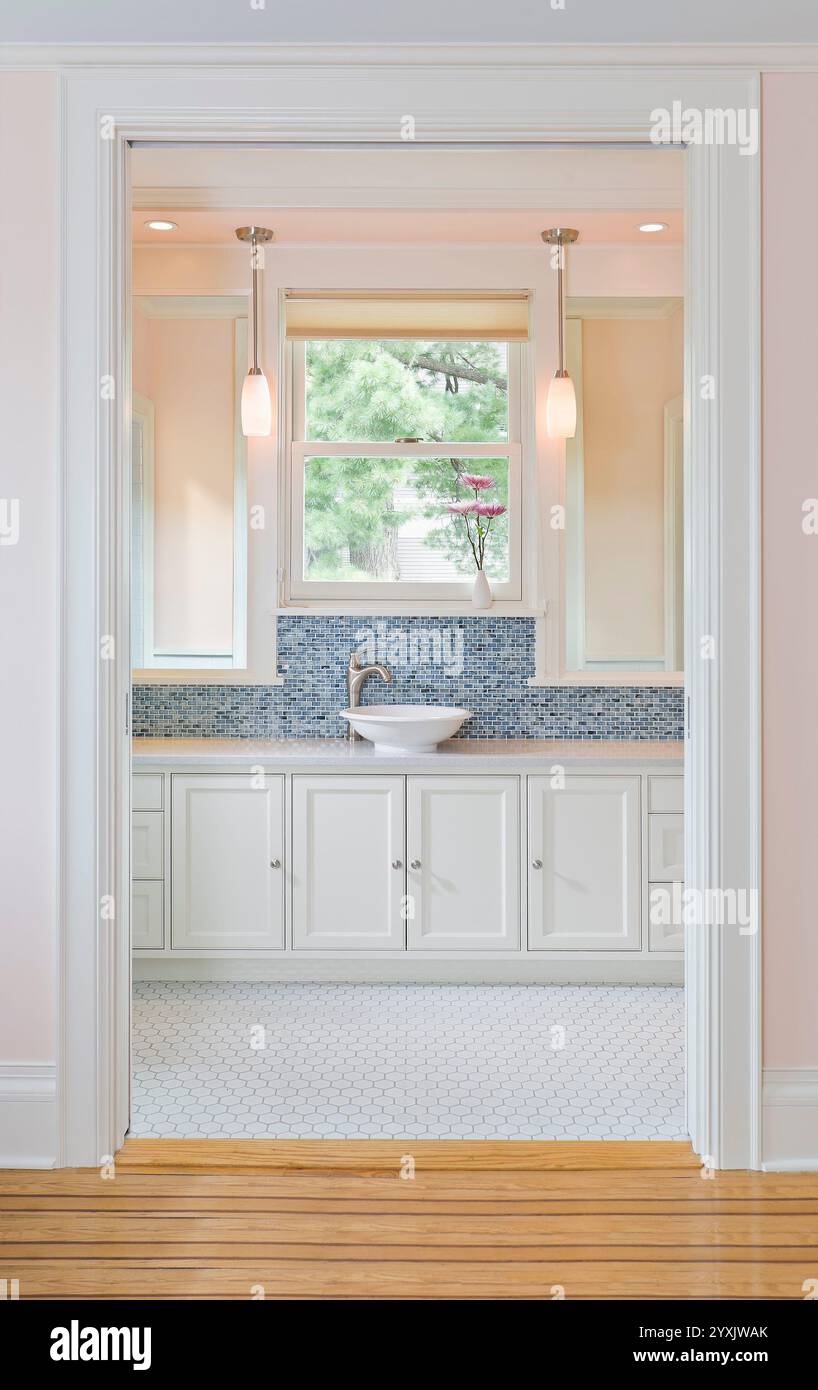 Entrance to pretty feminine bathroom with pink walls and blue mini-tile ...